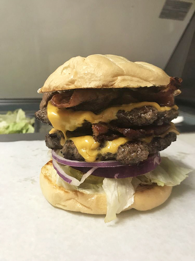 This isn't just a bacon cheeseburger&mdash;it's a towering monument to the art of excess. Melty cheese cascades over hand-formed patties like a yellow waterfall of joy.