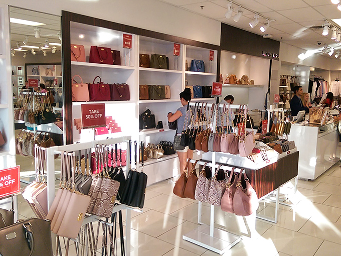 Kate Spade's colorful handbag haven where "just looking" becomes "just one more" faster than Texas summer lightning.