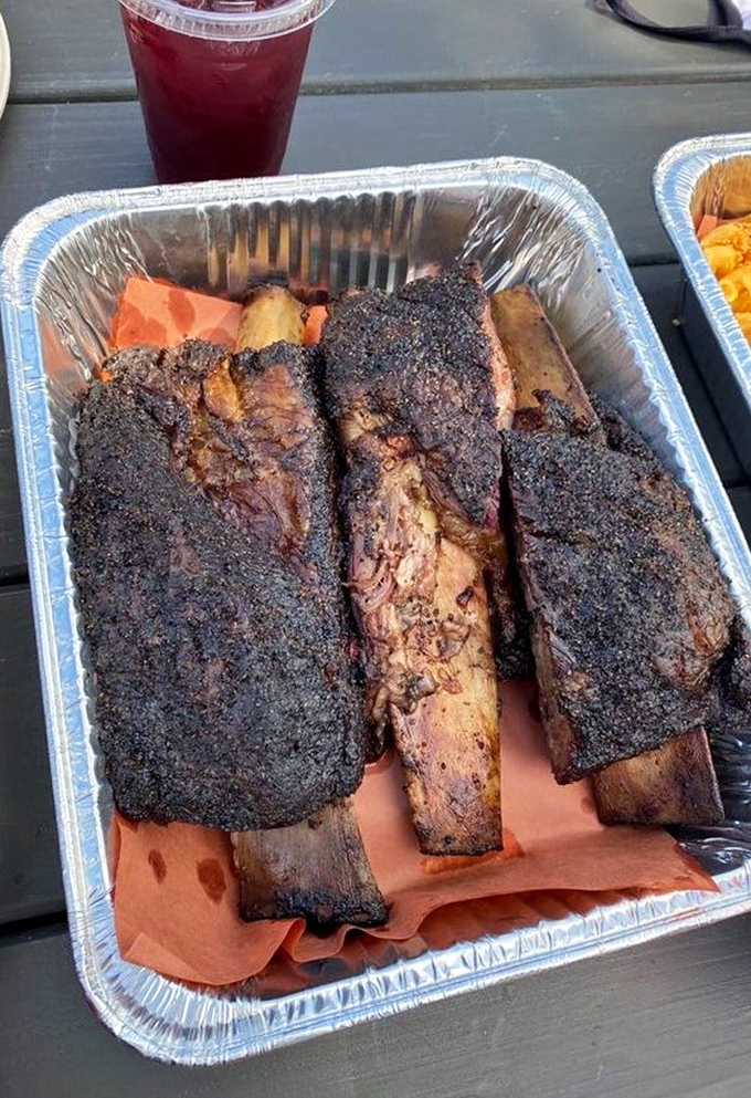 Beef ribs so magnificent they deserve their own ZIP code. The bark alone would make a Texan weep with joy.