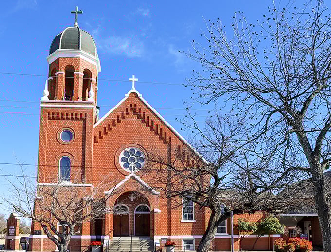 Blessed Sacrament Catholic Church reaches skyward with its distinctive bell tower, a spiritual landmark against Oklahoma's famously expansive blue skies.