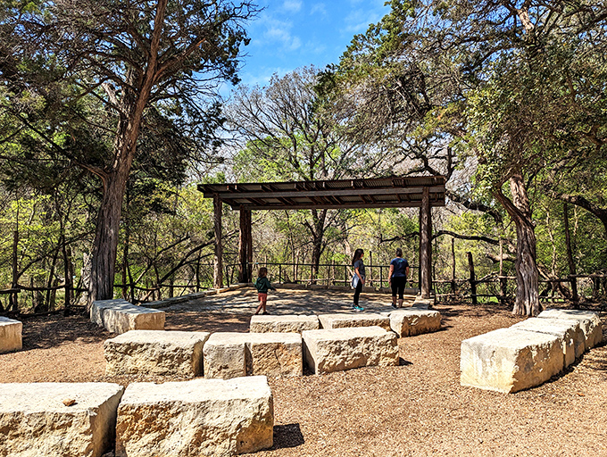 Nature's amphitheater carved in limestone, where concerts echo through the trees and Hill Country magic happens nightly.