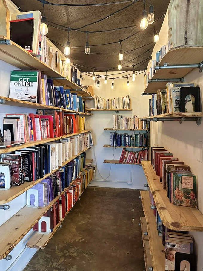 This literary nook, illuminated by Edison bulbs, houses countless stories waiting for their next chapter with a new owner.