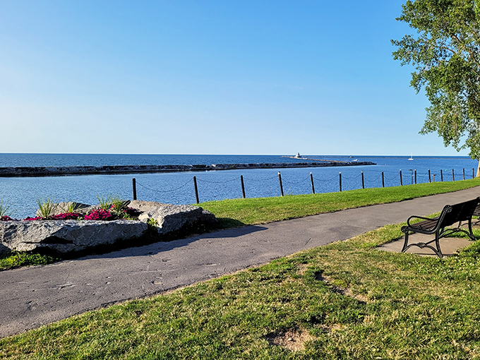 Lake Ontario stretches to the horizon like nature's infinity pool, offering a peaceful respite where retirement dreams come with a water view.