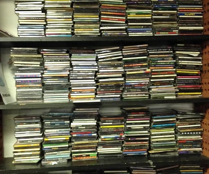 Music lovers could spend hours flipping through these CD towers, hunting for that one album that defined their youth.