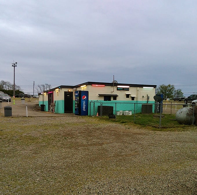 This humble snack shack holds the key to drive-in bliss&mdash;where popcorn dreams and soda wishes come true.