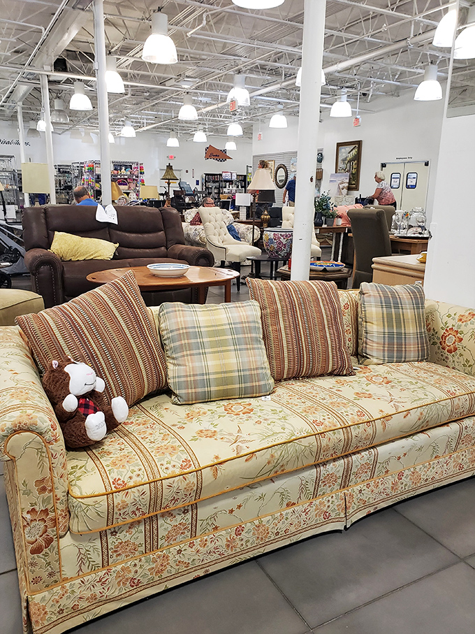 This floral sofa isn't just furniture&mdash;it's a time machine to Grandma's living room, complete with plaid pillows and nostalgic comfort.