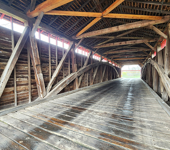 Step inside and you're transported to another era, where wooden beams create a cathedral-like geometry bathed in filtered sunlight.