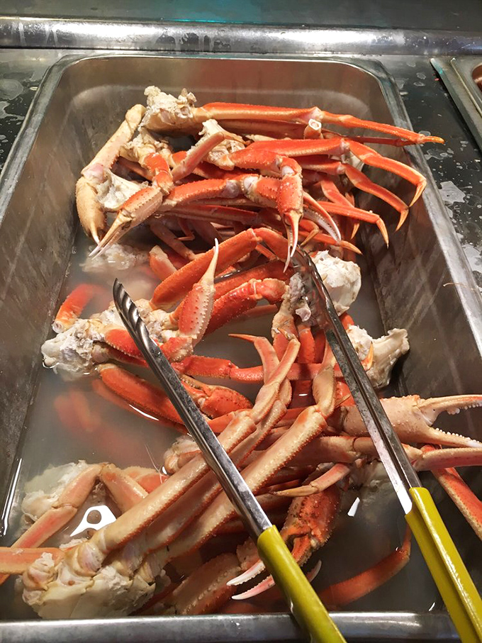 The main event: snow crab legs glistening with promise. These ruby-red treasures contain sweet meat that makes grown adults consider wearing a bib without shame.