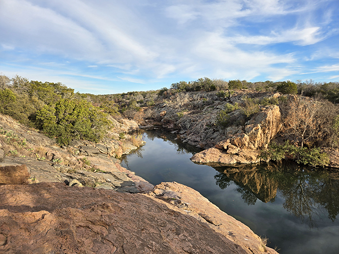 Devil's Waterhole proves that sometimes the best swimming pools come without chlorine, membership fees, or judgmental lifeguards.