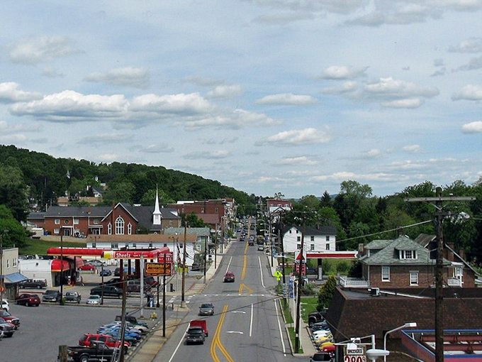 These historic homes along Main Street showcase architectural character that would cost a fortune elsewhere, but here they're part of everyday affordable living.