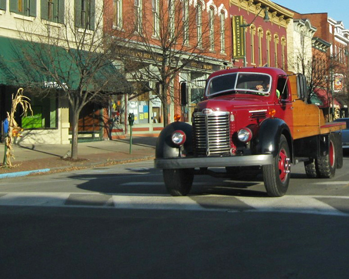 A vintage truck rumbles down Main Street, where the pace of life moves slower and neighbors still recognize each other's vehicles.