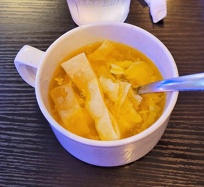 Behold the legendary egg drop soup in all its golden glory. Those delicate ribbons of egg swimming gracefully in broth&mdash;like tiny flavor rafts on a savory sea.