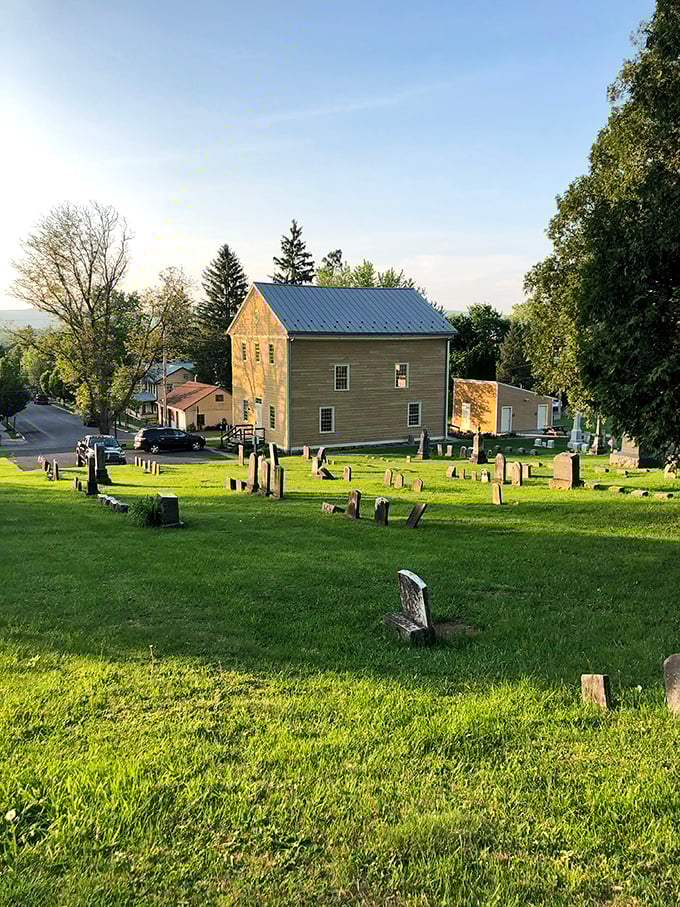 This peaceful cemetery with its simple green building tells Mifflinburg's story through generations, where history rests quietly on a hillside overlooking the town it helped build.