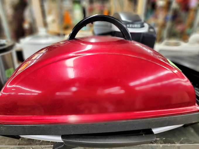 The cherry-red grill that promises paninis without pretension. Someone's abandoned New Year's resolution becomes your kitchen upgrade.