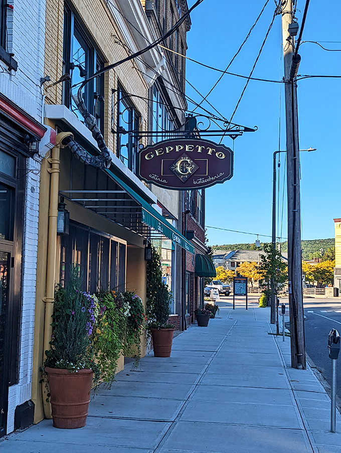 Geppetto's sidewalk charm makes you wonder if Pinocchio might be waiting inside with a real Italian feast.