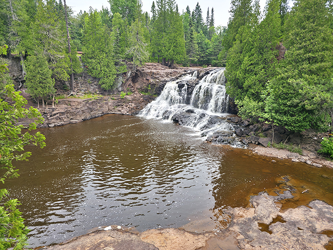 Middle Falls puts on a show worthy of Broadway, tumbling over billion-year-old volcanic rock in a performance that never takes a day off.
