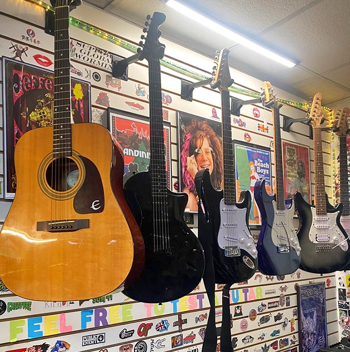 A guitar collector's dream wall &ndash; from acoustic classics to electric showstoppers, each instrument silently holding decades of phantom riffs and forgotten melodies.