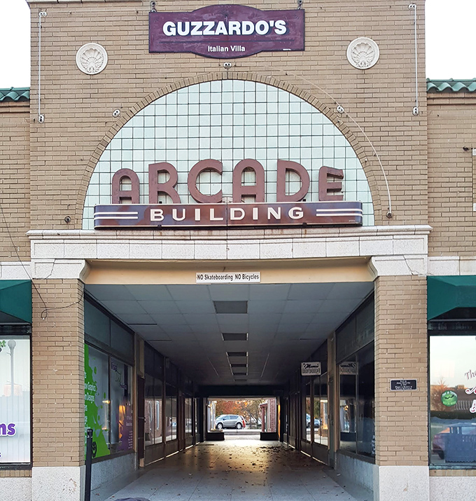 The iconic Arcade Building houses Guzzardo's Italian Villa, where generations of locals have debated the merits of thin versus thick crust while passing the parmesan.