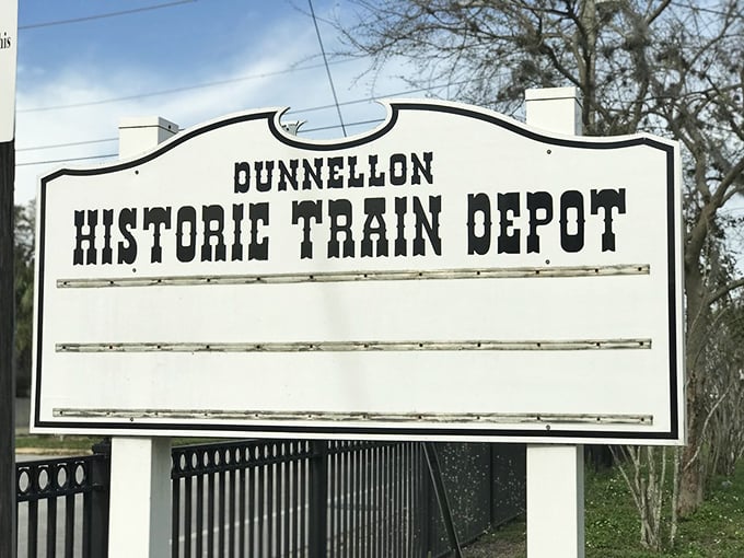 The Dunnellon Historic Train Depot sign stands as a reminder that this town was once a bustling crossroads&mdash;now it's where hurried lives come to a peaceful halt.