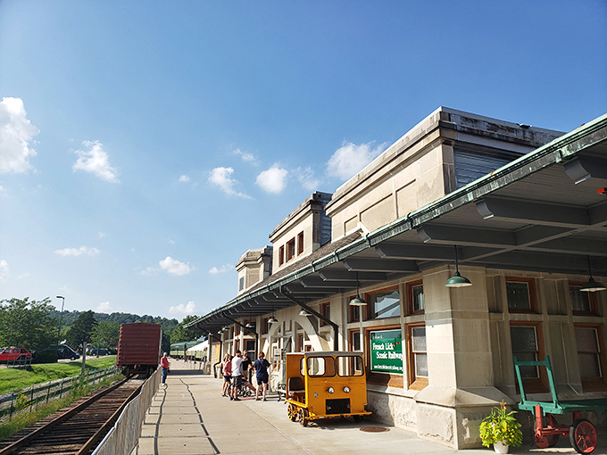 The historic French Lick depot welcomes travelers with its timeless limestone architecture and wide-brimmed awnings, a portal to railway's golden age.