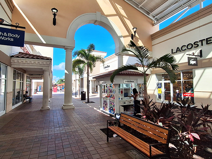 Elegant archways and strategically placed palm trees create the illusion that you're strolling through a fancy resort, not embarking on an Olympic-level shopping marathon.