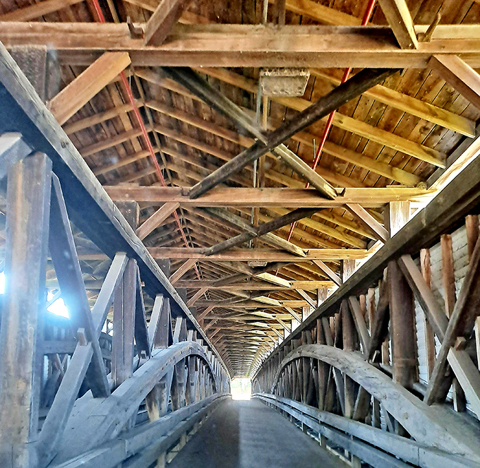 Looking up inside reveals the architectural equivalent of nature's cathedral &ndash; wooden beams creating a mesmerizing pattern that's been sheltering travelers since before Instagram could make it famous.