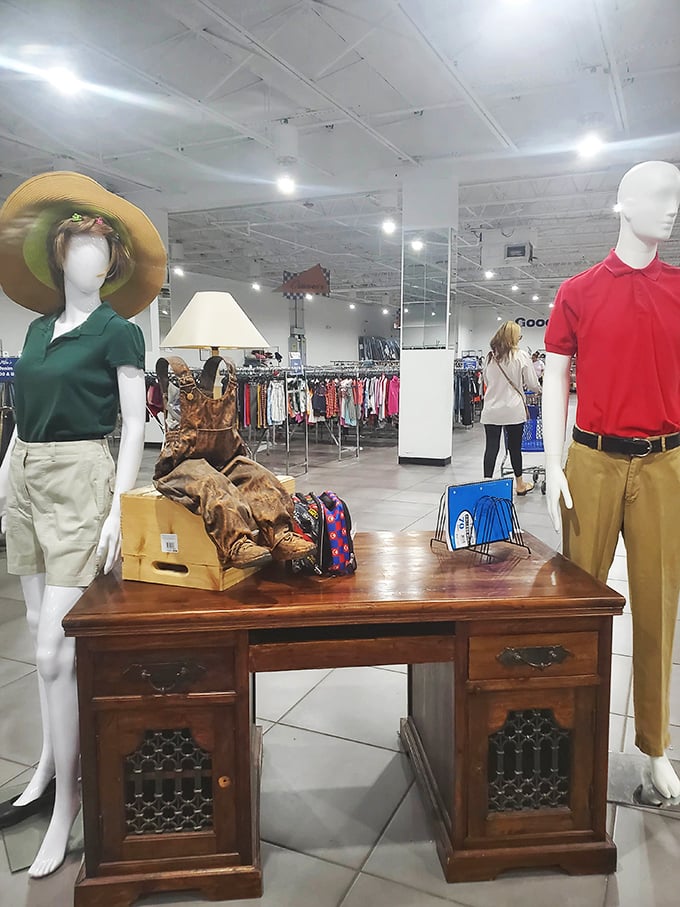 Mannequins standing guard over vintage furniture gold. That ornate wooden desk could have starred in "Mad Men" before landing here at a fraction of its worth.