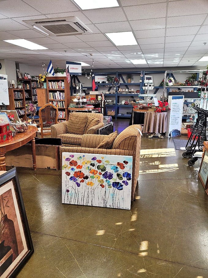From comfy seating areas to well-organized shelves, the interior feels more like a boutique than a thrift store. That colorful artwork? Probably someone's lucky find. 