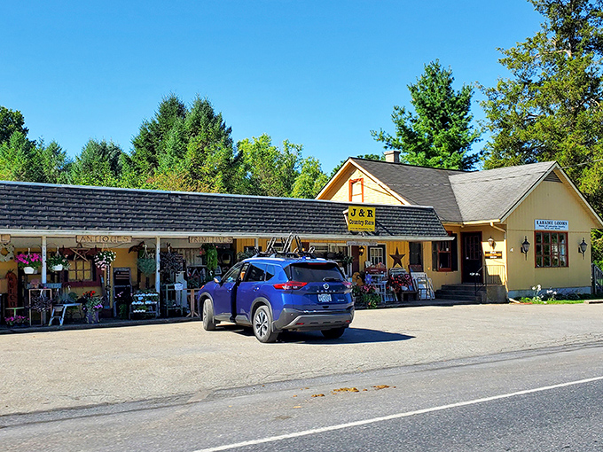 J&R Country Store stands as a cheerful yellow beacon of retail therapy, country-style&mdash;no app required, just good old-fashioned browsing.