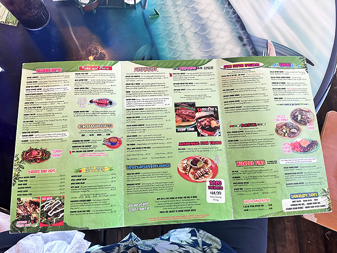 The menu unfolds like a treasure map, with X marking the spot for everything from blackened mahi to those legendary coconut shrimp.
