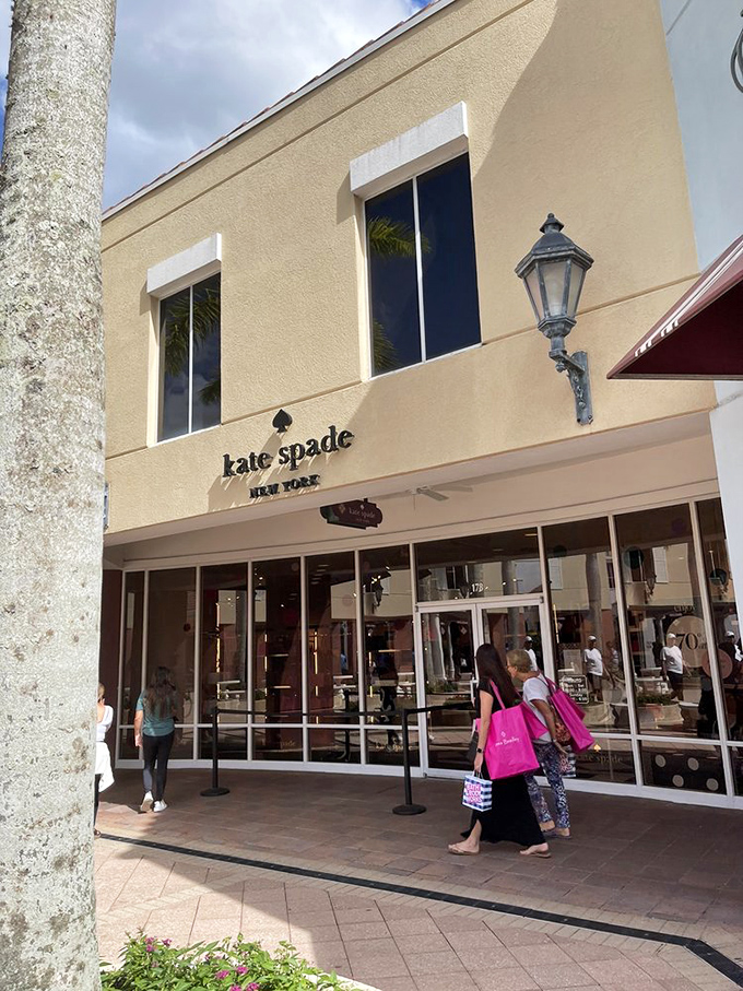 Kate Spade's storefront promises polished sophistication at pinch-me prices – the handbag holy grail for savvy shoppers.