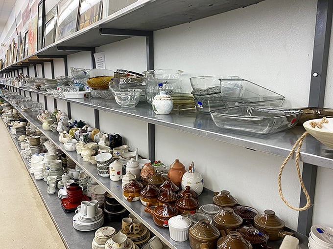 Grandma's kitchen exploded and landed perfectly organized on these shelves. Every Pyrex dish tells a story; every teacup awaits its second act.