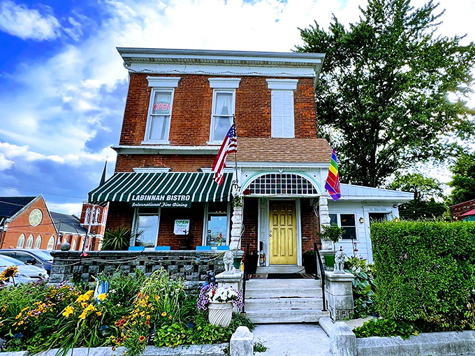 LaBinnah Bistro's cheerful yellow door and vibrant garden beckon like a neighbor who always has something delicious simmering on the stove.