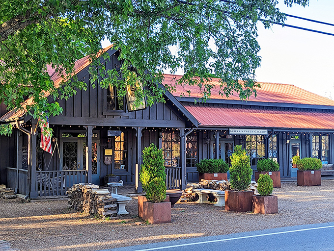 That gorgeous black barn with rustic red roof isn't just a building&mdash;it's practically the unofficial welcome committee to Leiper's Fork.