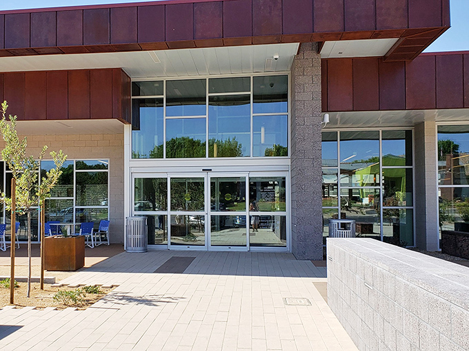 Glass doors welcome you into air-conditioned sanctuary where books outnumber drama and computers actually work when you need them.