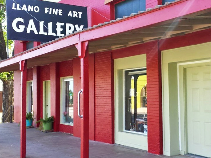 The vibrant red Llano Fine Arts Gallery stands as colorful proof that creativity thrives far beyond big city limits.