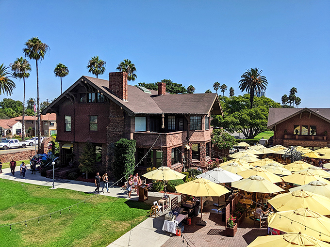 Yellow umbrellas dot the courtyard of this historic brick building like buttercups in a meadow, creating the perfect spot for that mid-exploration coffee break.
