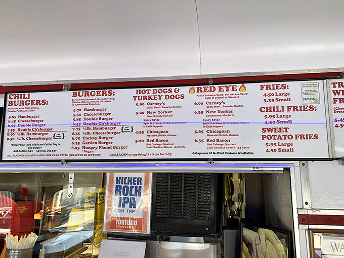 The menu board tells a simple story: burgers, dogs, and fries done right. No culinary pretension, just the promise of satisfaction.