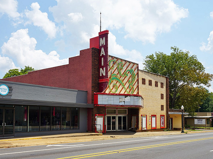The Main Theater's vintage marquee promises entertainment the old-fashioned way—no algorithms required, just community gathering under one roof.