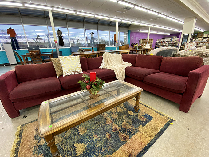 This burgundy sectional staged with throw pillows isn't just furniture&mdash;it's your next Netflix marathon headquarters waiting to happen.