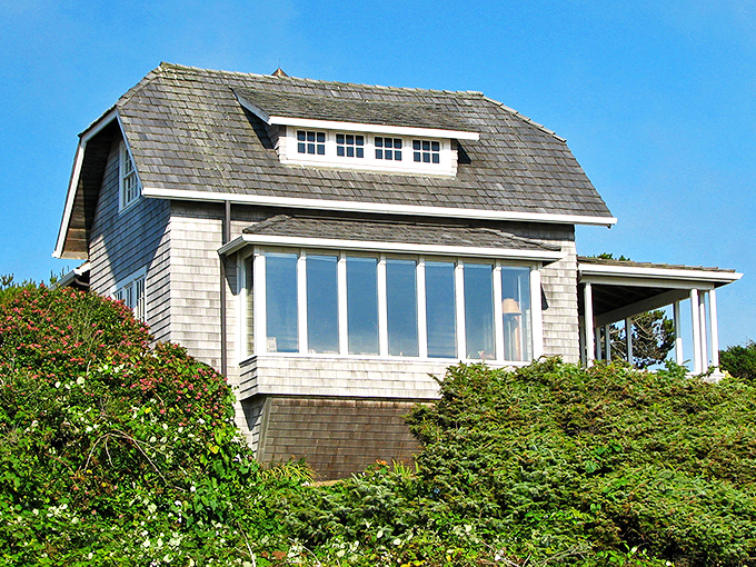 This classic cedar-shingled cottage perched above the shoreline embodies the quintessential Oregon coast dream&mdash;windows perfectly positioned for storm-watching and sunset gazing.