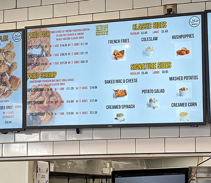 Decision paralysis has never been so delicious. The menu board showcases an impressive array of fried delights and sides that would make any Southern grandmother proud.