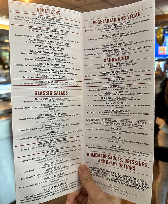 Navigating a diner menu requires strategy, patience, and possibly reading glasses. Bel Aire's epic food catalog could double as light exercise for your forearms.