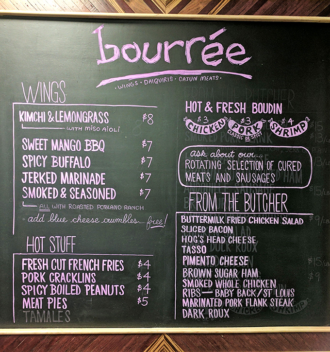 This chalkboard menu reads like a love letter to Louisiana cuisine, with wings that'll make you question everything you thought you knew about flavor.