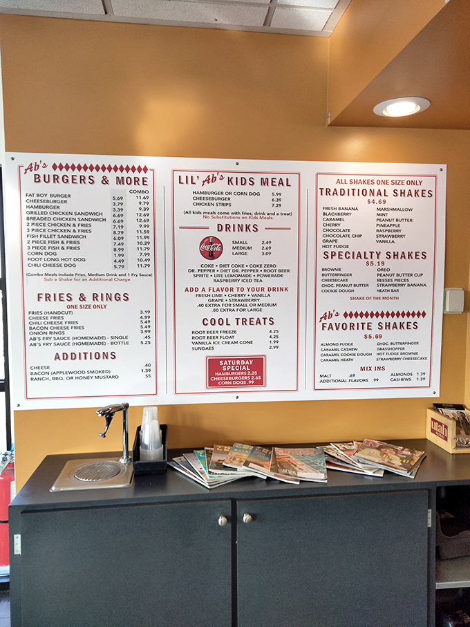 The menu board tells a delicious story: burgers, dogs, shakes, and treats that haven't surrendered to trendy food fads.