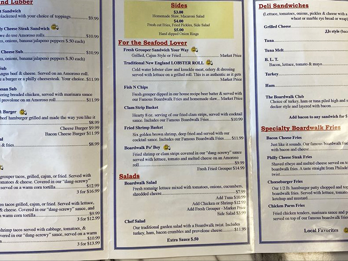 The menu reads like a love letter to seafood enthusiasts. Each item promises a different kind of happiness, with fish and chips taking center stage.