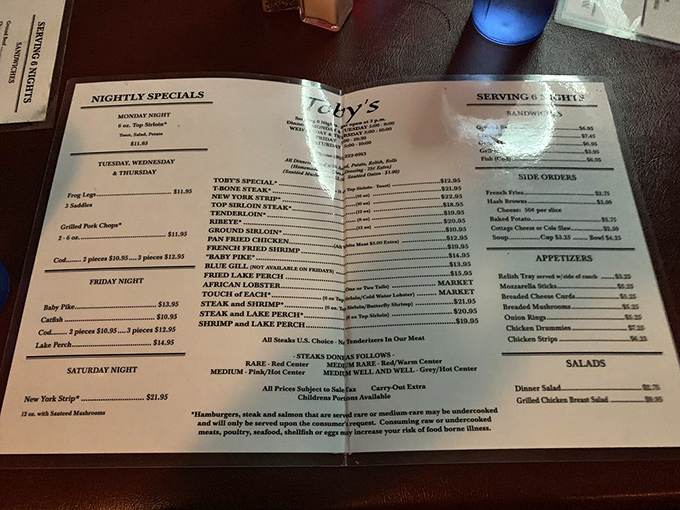 The menu tells the real story: decades of Wisconsin supper club tradition distilled into a single, mouthwatering page of possibilities.