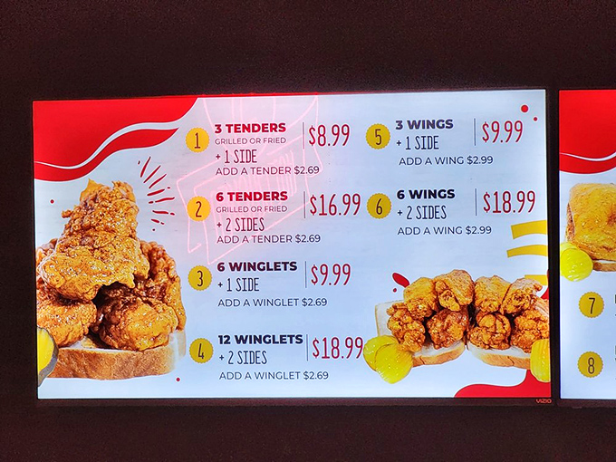 The menu board speaks the universal language of barbecue devotees: meat by the pound, classic sides, and the promise of smoky perfection.