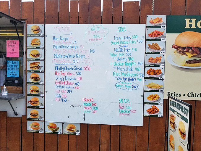 This menu board isn't just a list—it's a roadmap to happiness. The burger selection alone would make even the most dedicated cardiologist temporarily suspend judgment.