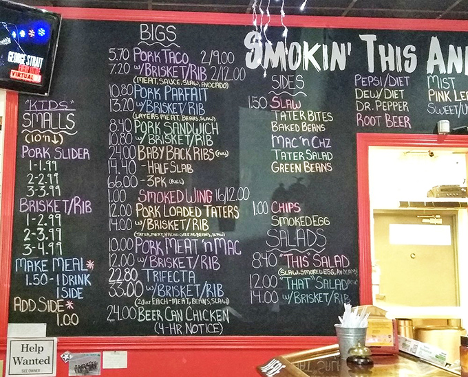 The chalkboard menu tells a story of smoked perfection. Each handwritten item represents hours of patience and dedication to the craft.